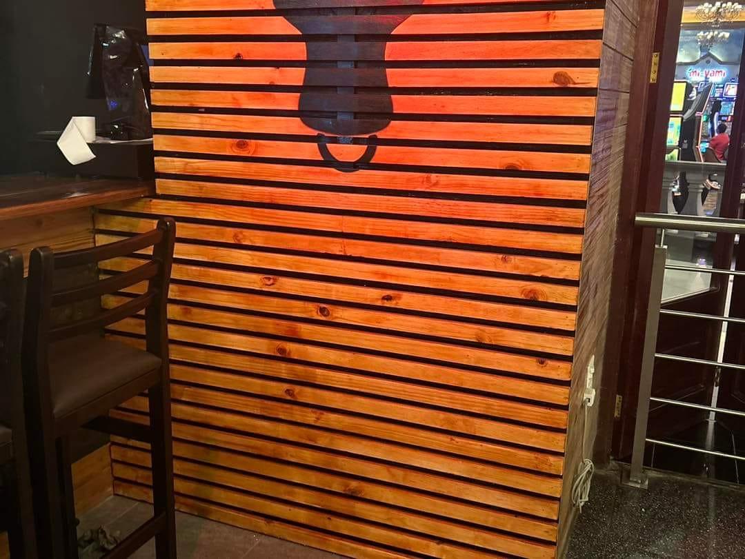 Innovative Vinyl Cladding Transforms Texan Wing Bar - Conway Flooring